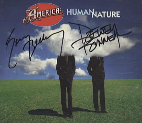 America Human Nature - AUTOGRAPHED Canadian CD album (CDLP) (341447)